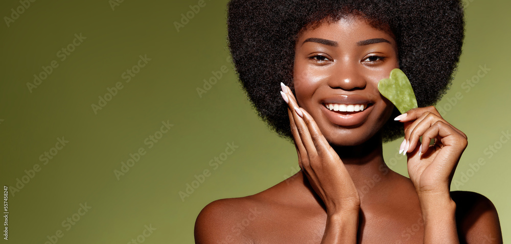 Gua Sha jade skin treatment. Face building. Facial contour. African ...