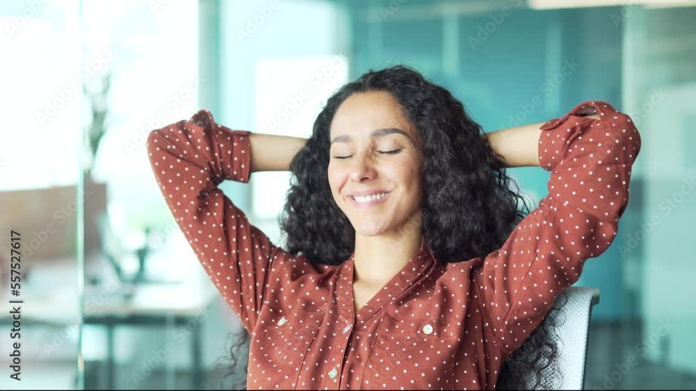 Young employee relaxing at workplace in office job done Satisfied ...