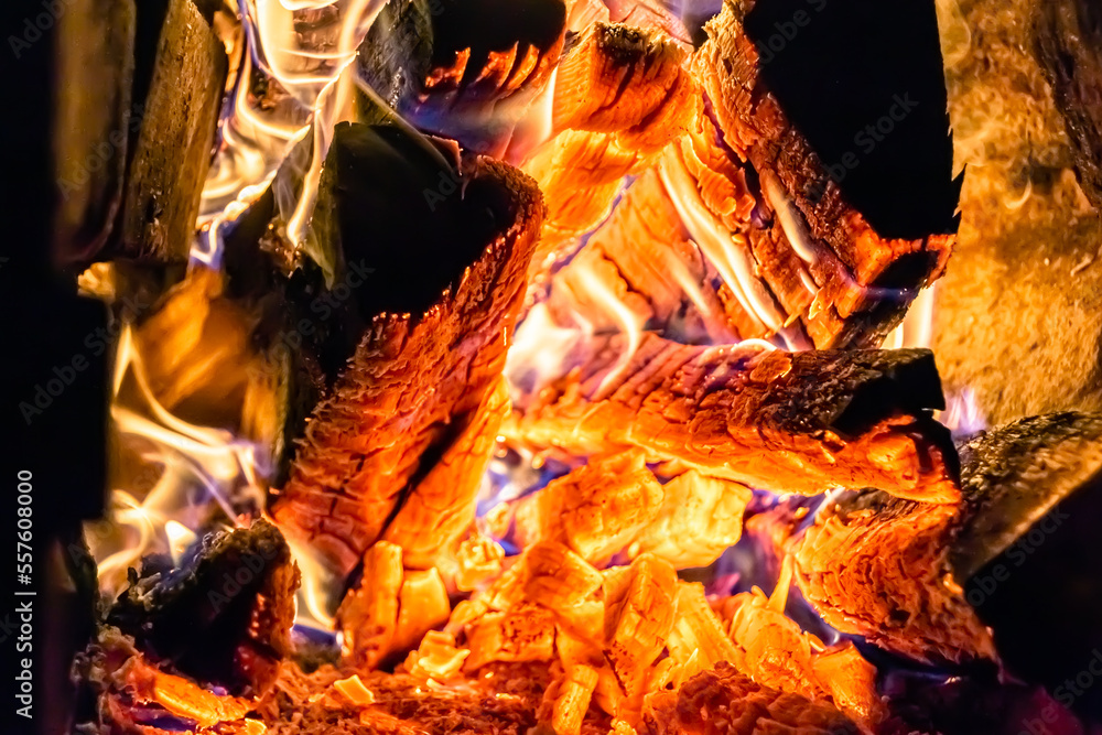 Beautiful old fireplace with light flame fire for heating building room ...