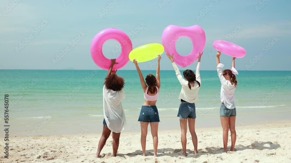 Slow motion Jumping. Group of teenager girls jump on the beach. Four ...