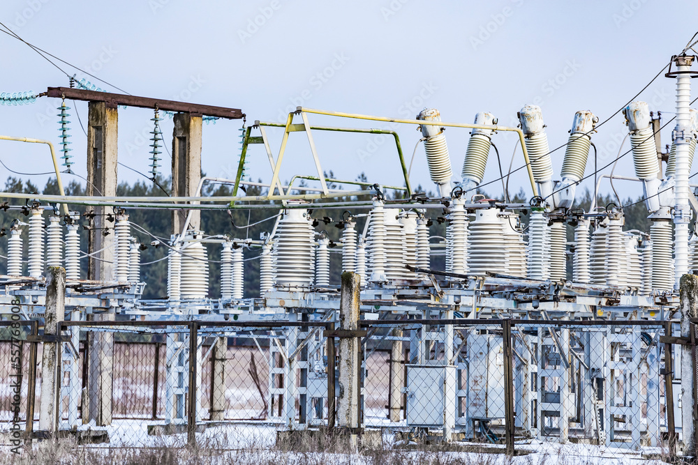 High voltage vintage electrical substation in Ukraine in winter. Wiring ...