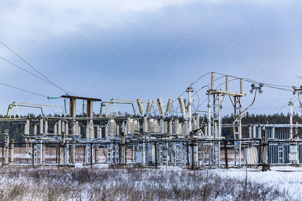 High voltage vintage electrical substation in Ukraine in winter. Wiring ...