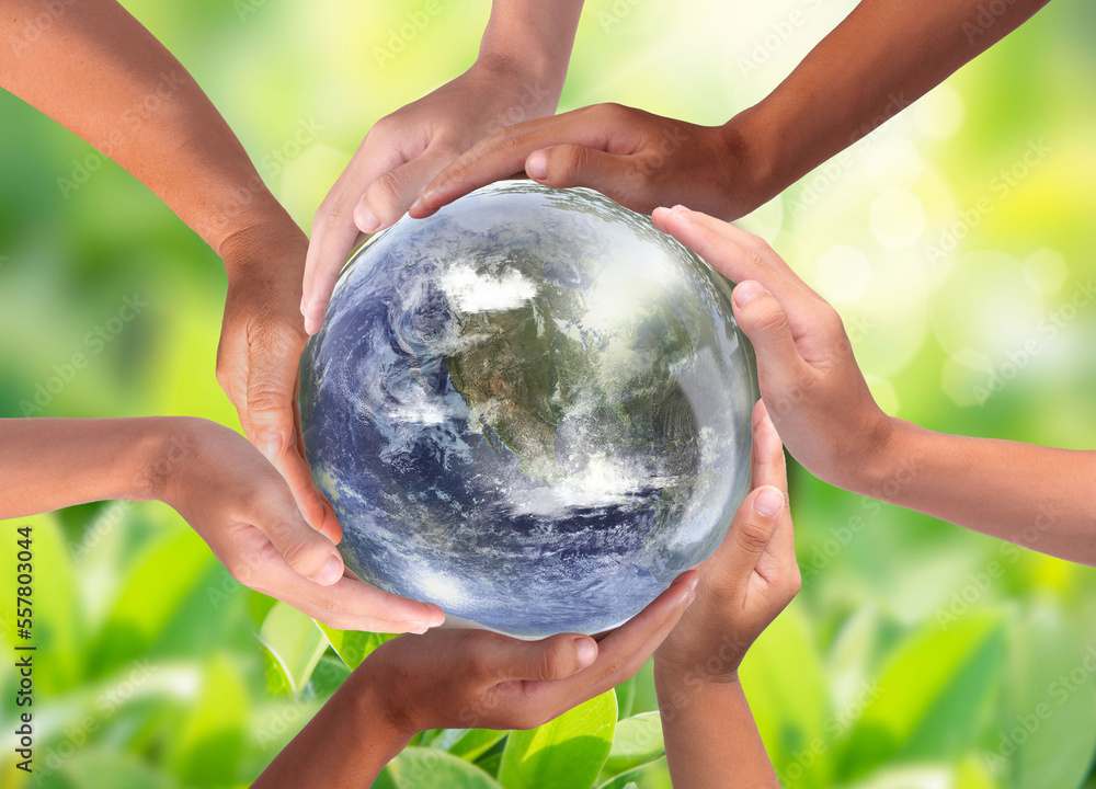 Conceptual symbol of multiracial human hands surrounding the Earth ...