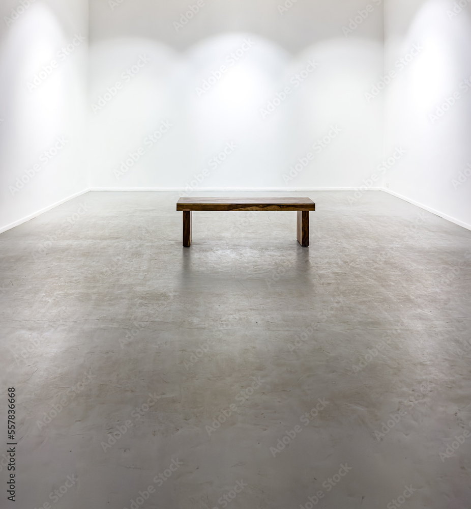 An empty wooden bench looking out on empty wall an art gallery Stock ...