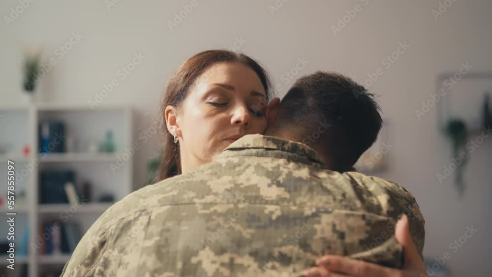 Soldier hugging his wife, saying farewells, being deployed to war ...