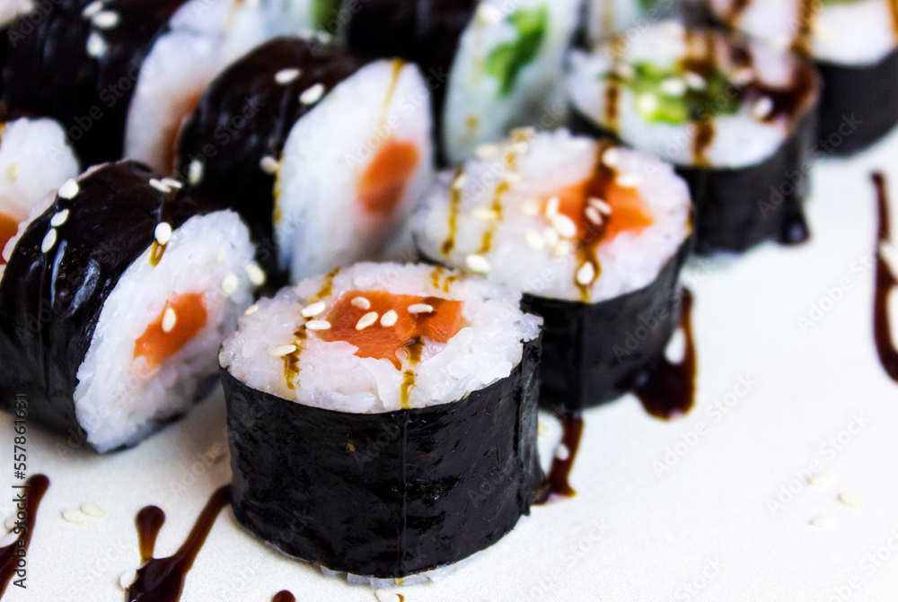 Sushi rolls with salmon on white background. Syake maki side view Stock ...