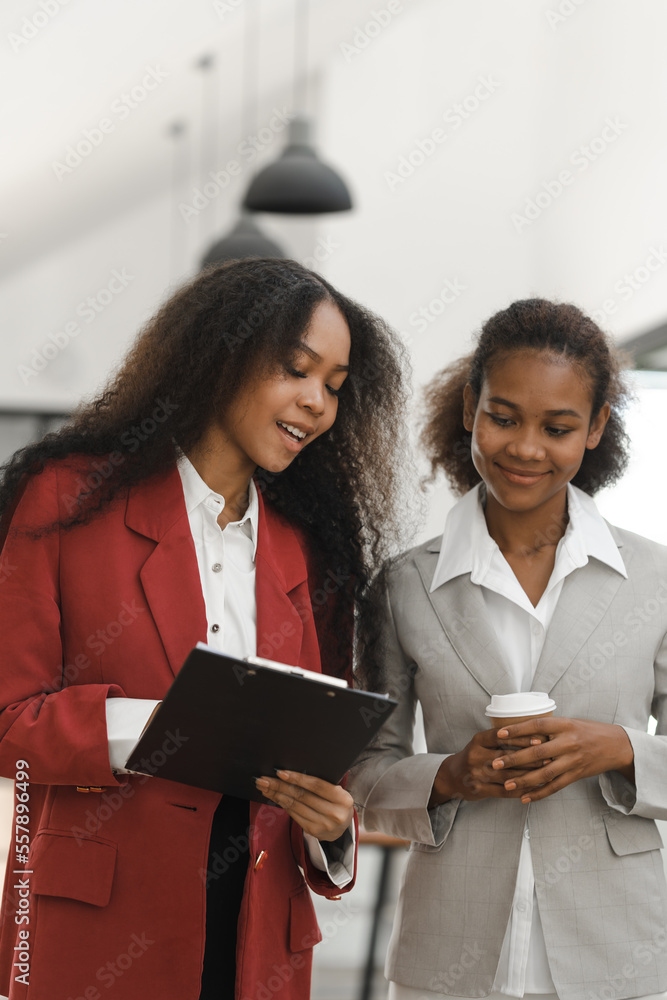 Foto de Young diverse african american female coworkers working ...