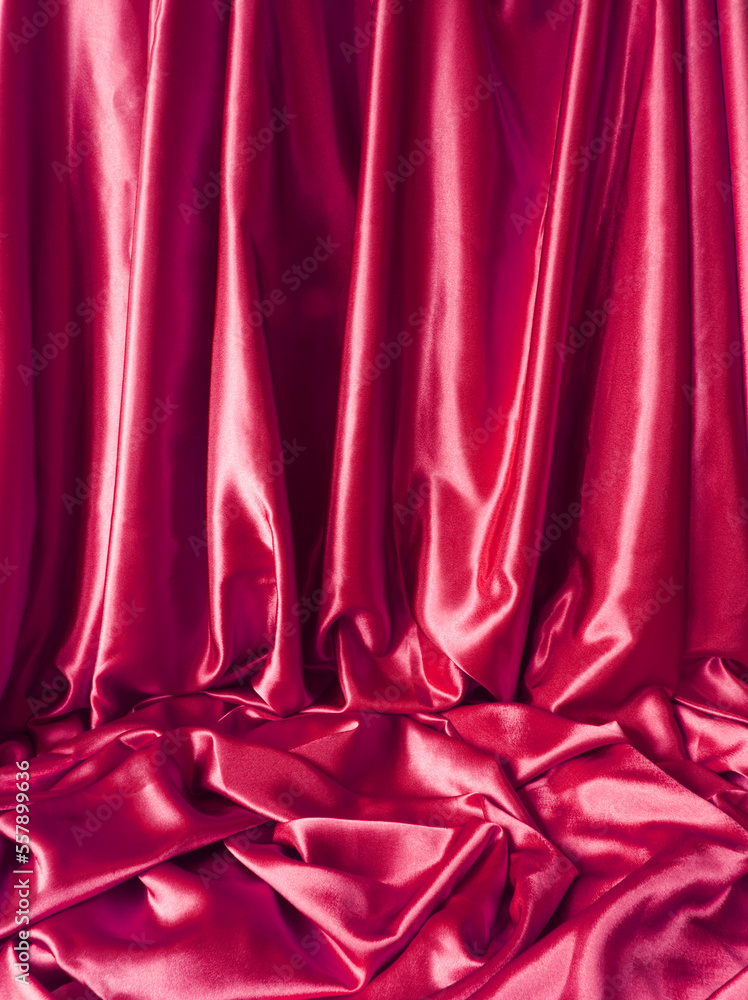 Elegant smooth red satin, silk fabric drapes. Luxurious cloth textile ...
