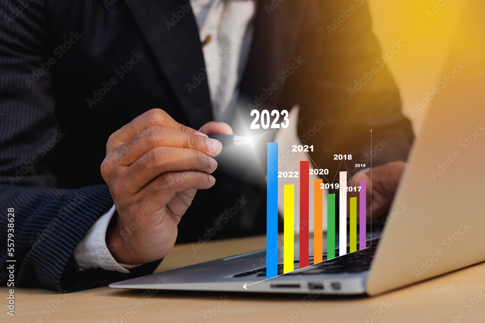 Businessman analysing sales growth bar graph 2023 year corporate future ...
