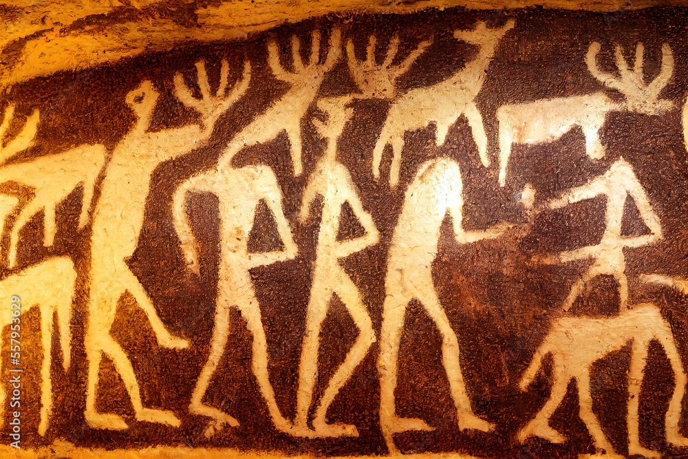 ภาพประกอบสต็อก Prehistorical cave paintings of hunting scene with deers ...