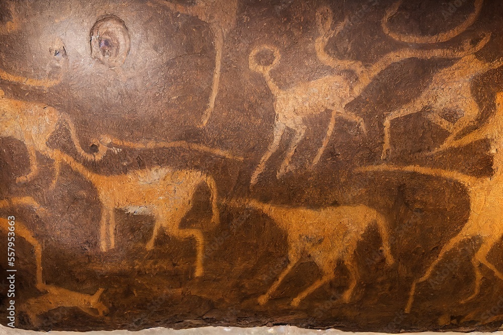Prehistorical cave paintings of hunting scene with deers and horses and ...