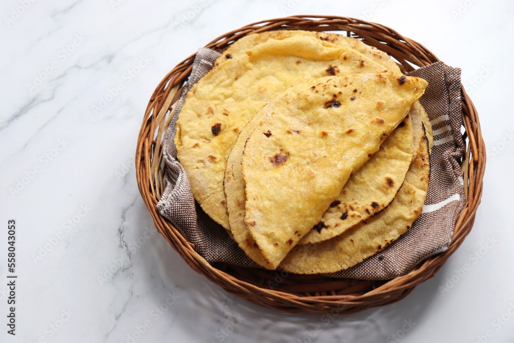 Makki di roti or Corn meal bread and mustard leaves curry. It's a ...