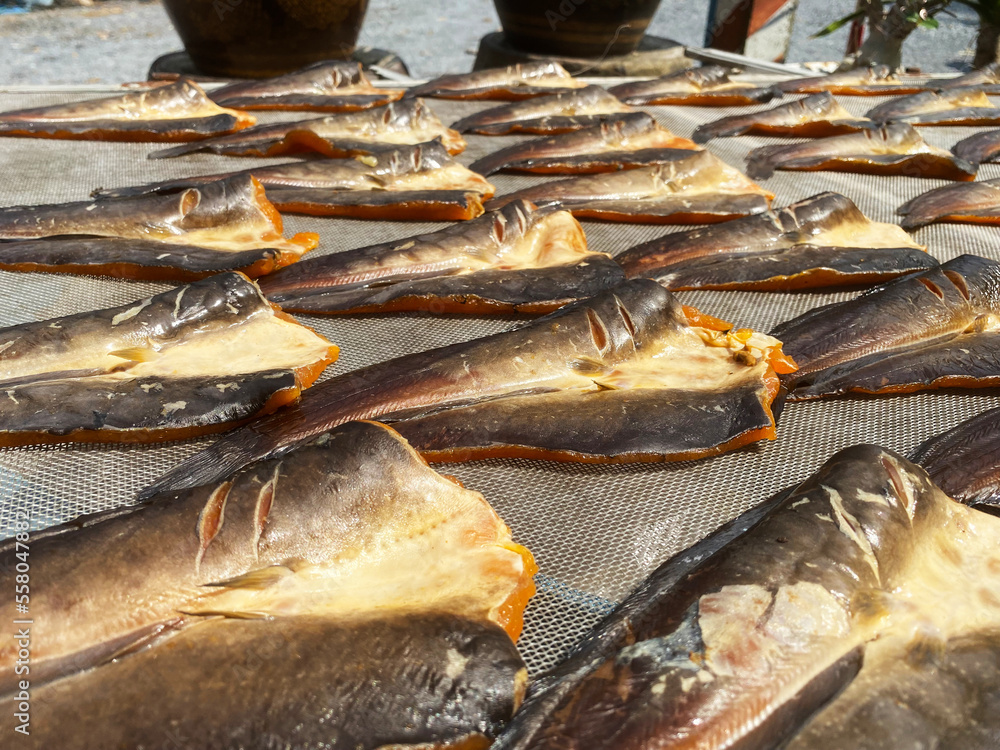 Catfishes are on the rack to make dried fish for sell Dried catfish is ...