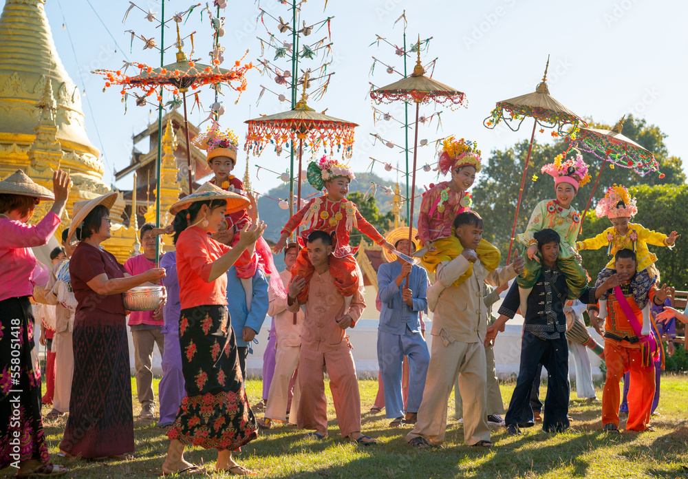 Group of Aisan people celebrating dance in front of golden pagoda in ...