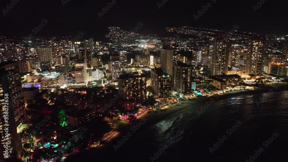 nighttime aerial view of waikiki with holiday lights and hotels on oahu ...