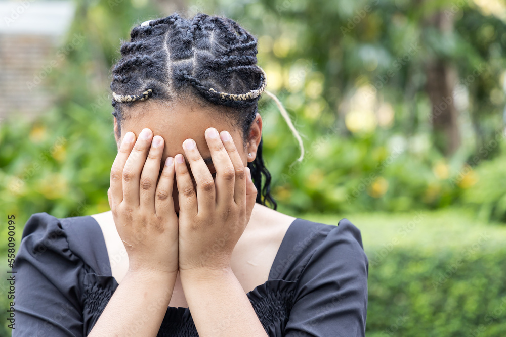 Stressful and sad African woman with scar doing facepalm gesture ...
