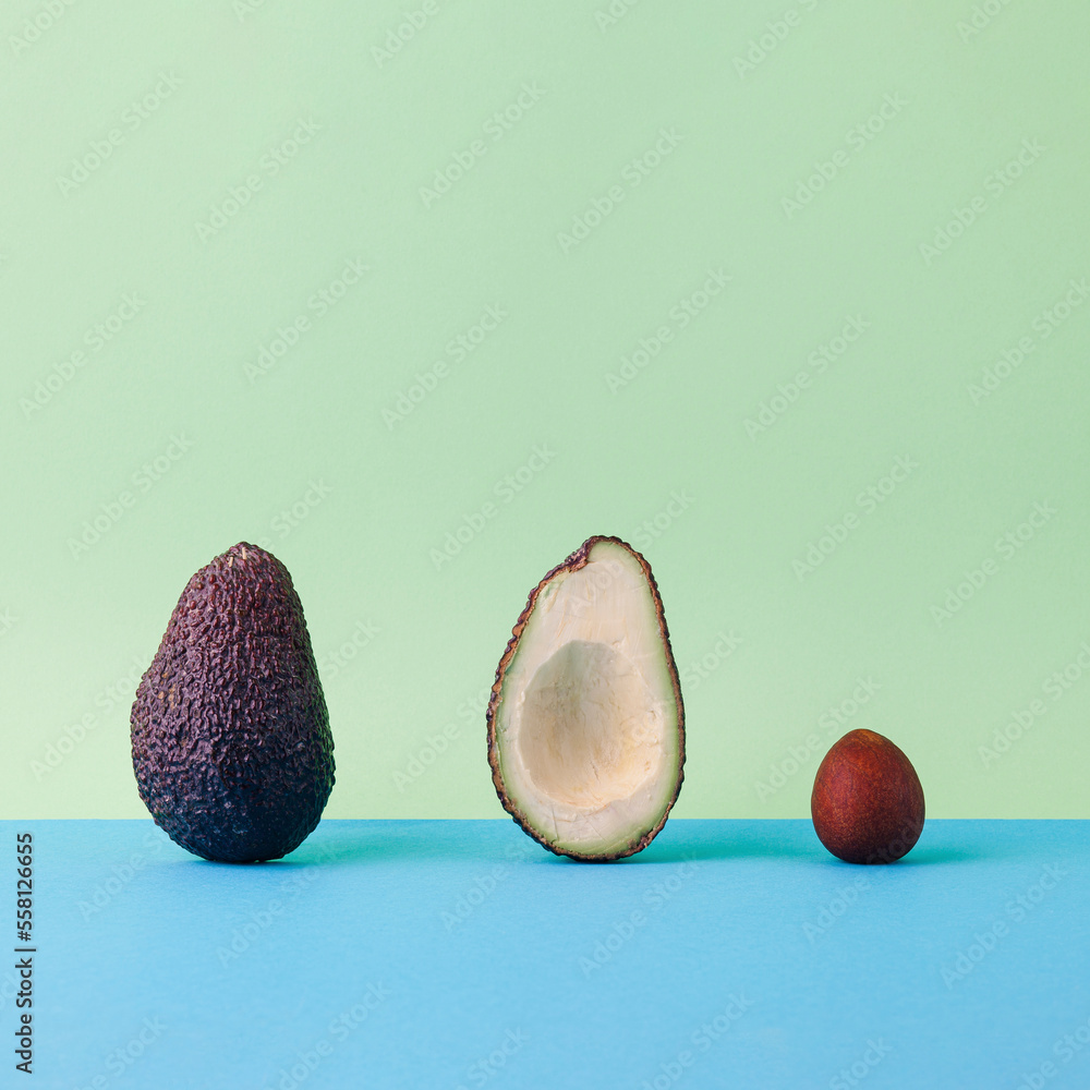 Stages of life. Avocado from outside, sliced and inside. Fruit seed ...