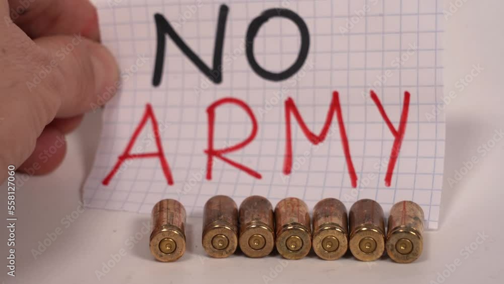 Video Stock No Army and no war logo sign with 9 mm revolver gun ballets ...
