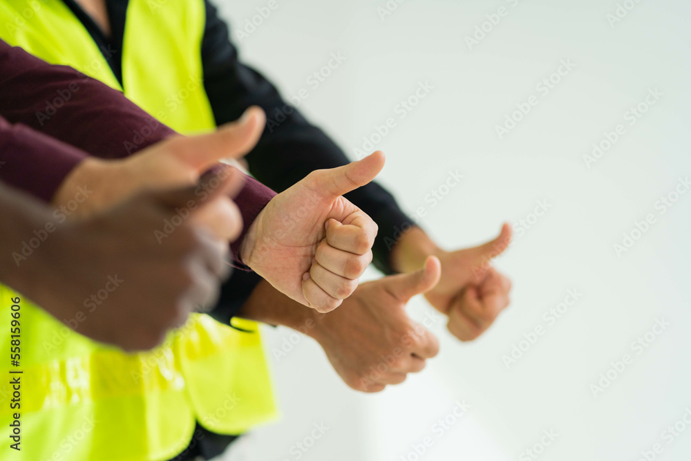 Foto de Engineers stand in line, ready to work. Diverse group of ...