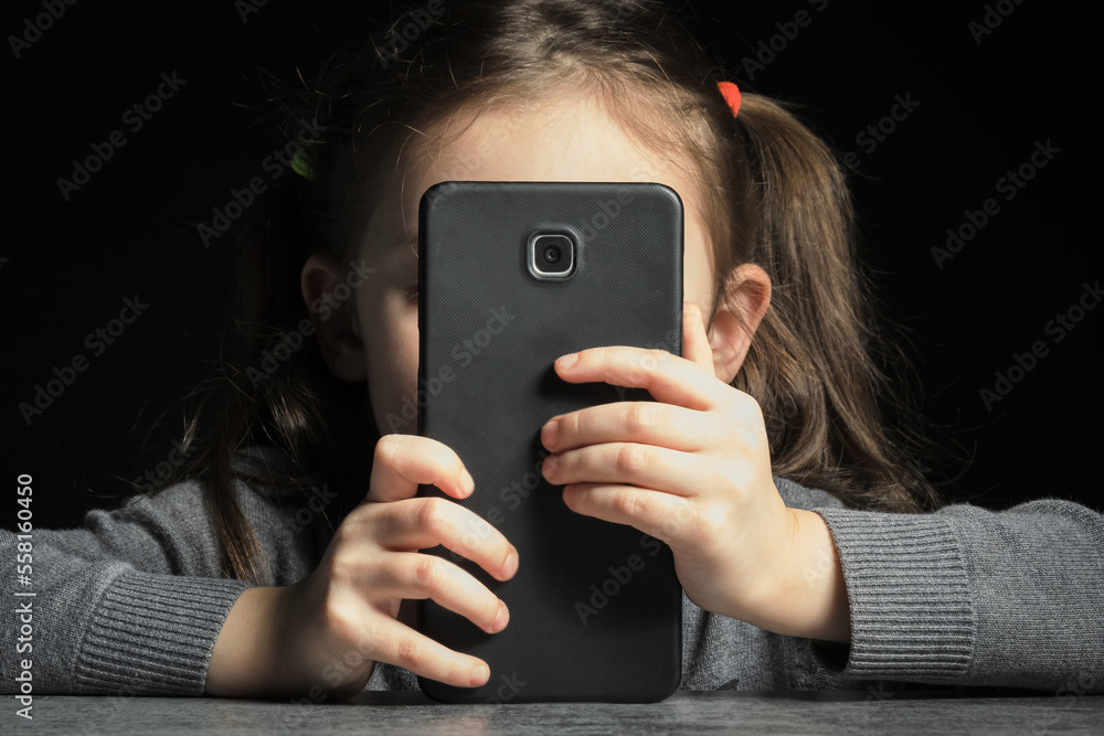 Problem of kids addiction to gadgets, online and screen time. Little ...