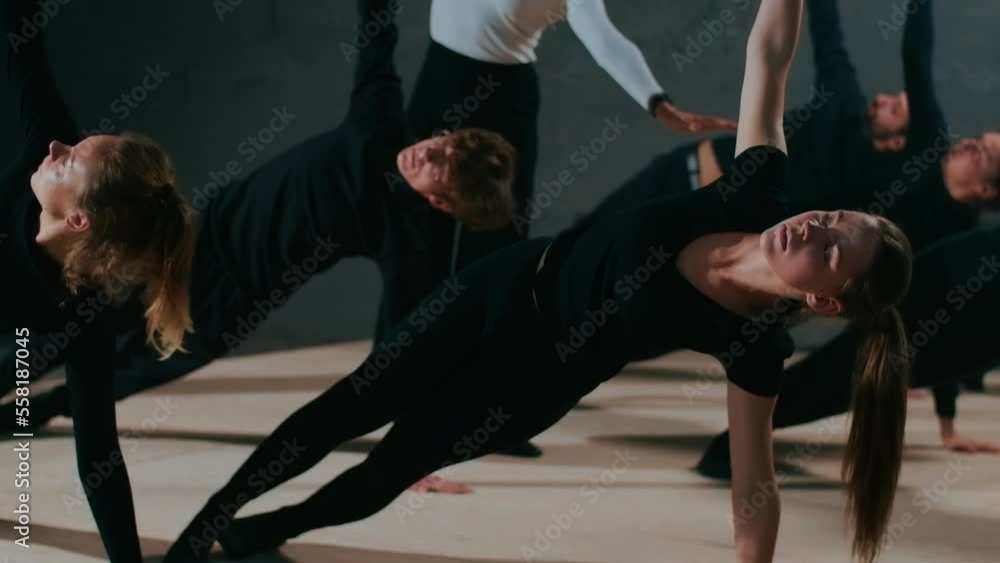 Side view group of theater actors and actresses in plank position ...