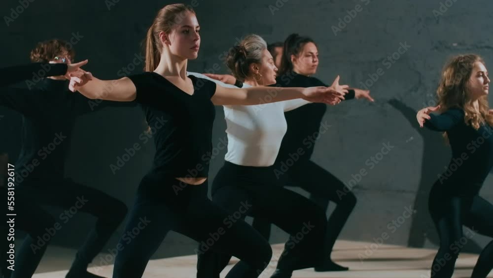 Gorgeous slim actress rehearsing with colleagues as stage director ...