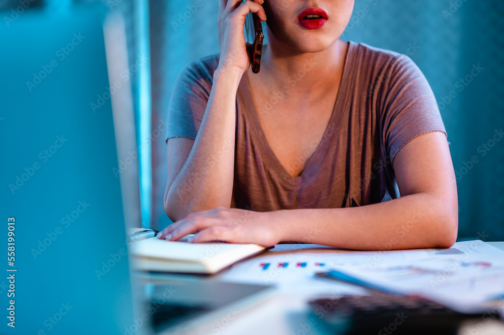 Asian Businesswoman working hard and talking telephone about the ...