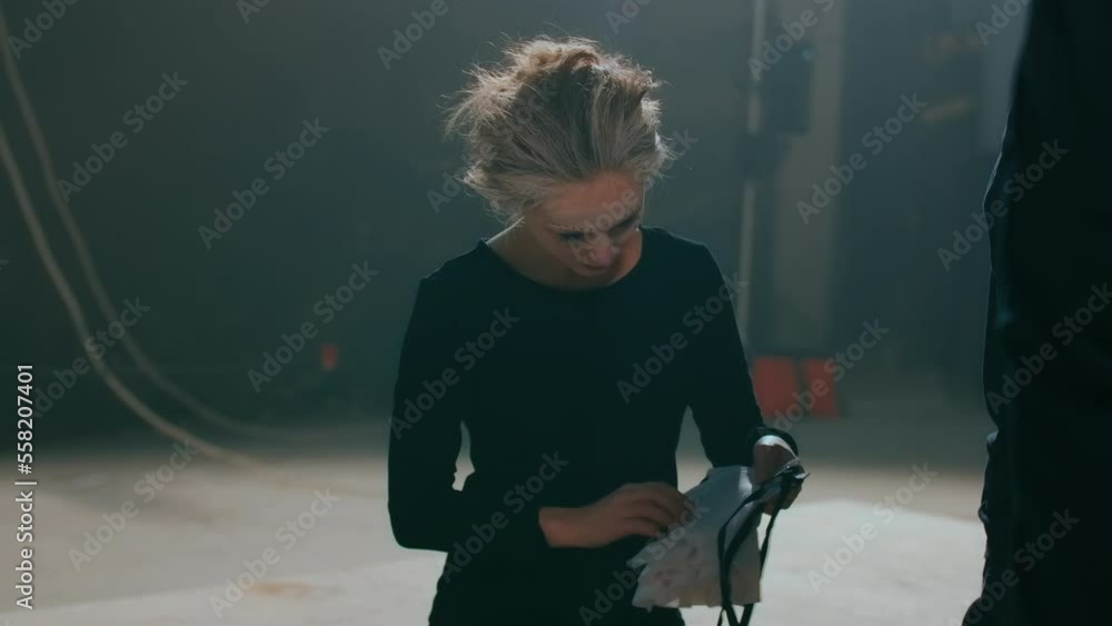 Medium shot portrait of concentrated young actress with stage makeup ...