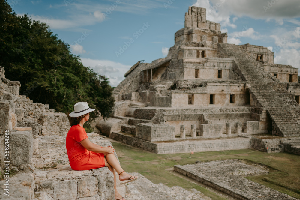 Travel woman in red dress looking at mayan ancient pyramid Etzná, Campeche, Mexico, Yucatán ...