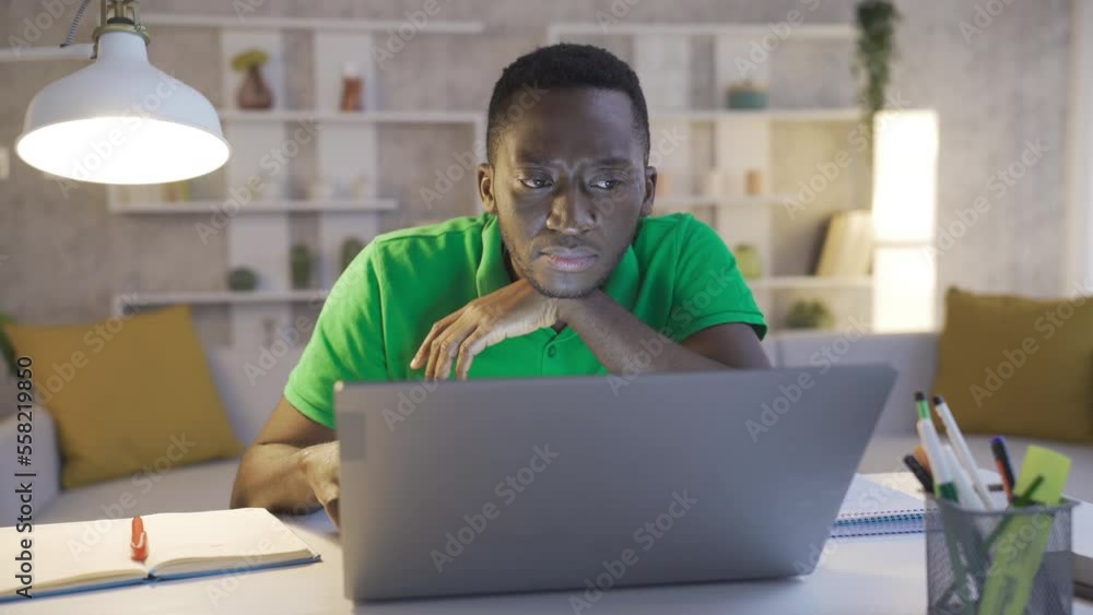 Black african man working in home office working thoughtful and focused ...