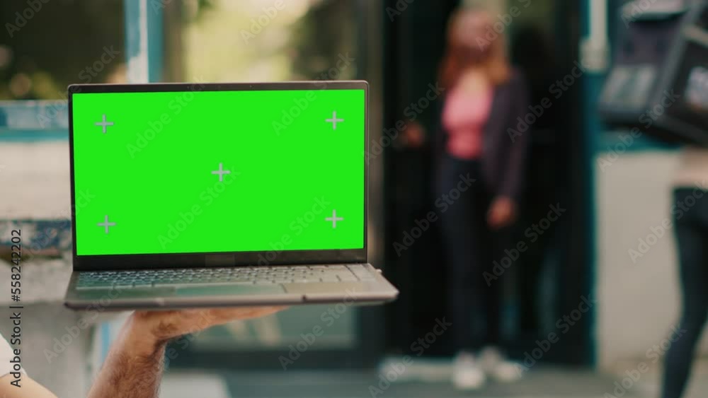 Man holding laptop with greenscreen on display, delivering food order ...