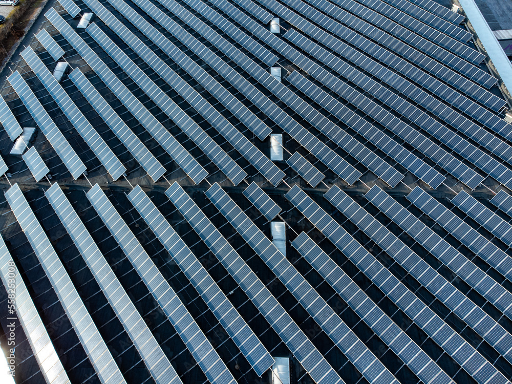 Large solar panel array on rooftop top down aerial view Stock Photo ...