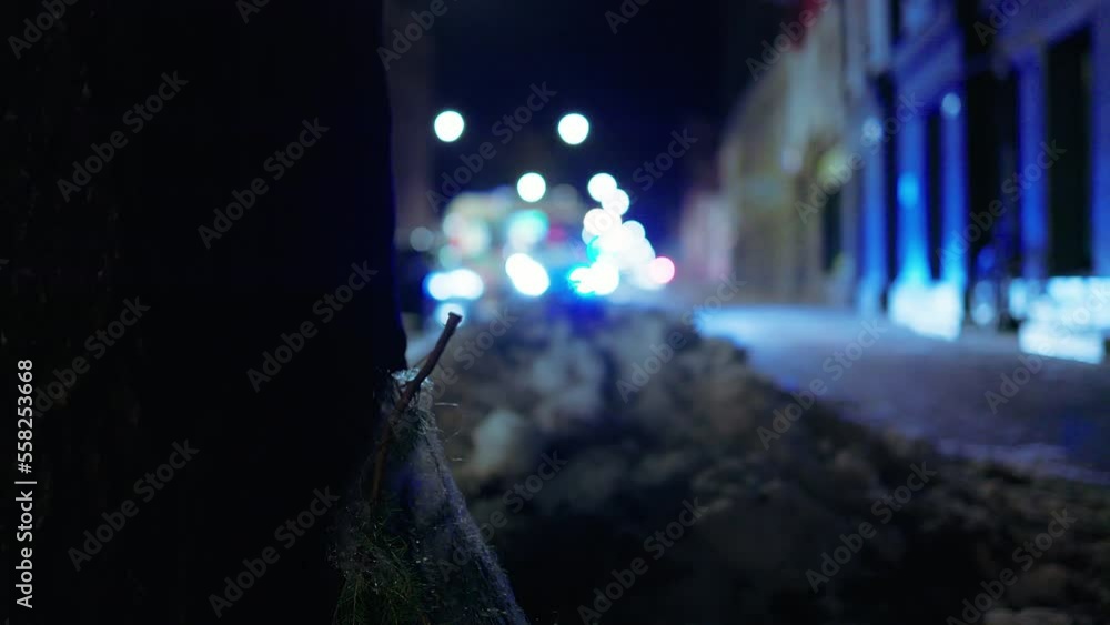 Crime scene revealing shot: Ambulance with flashing siren lights at ...