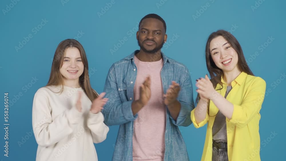 Three friends of different races applaud, congratulate. Different race ...