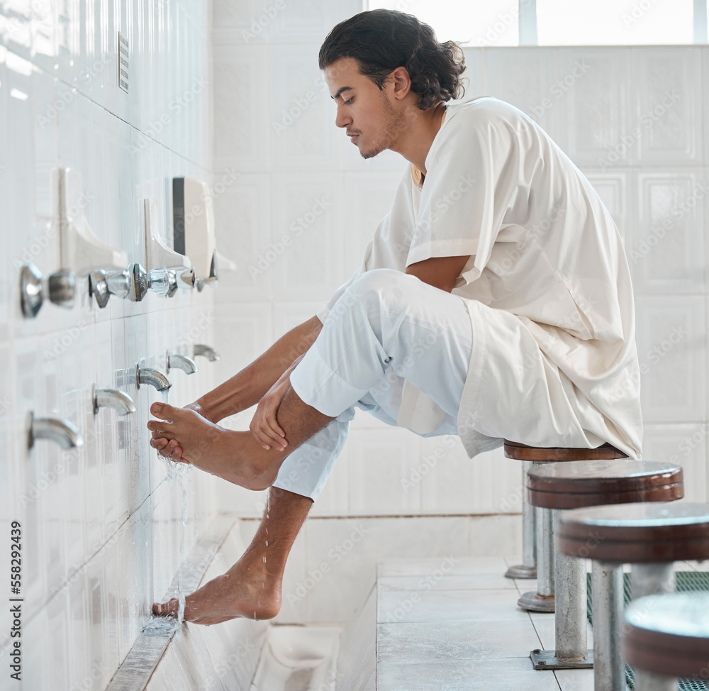 Muslim, water and man cleaning feet for ablution, wudu or spiritual ...