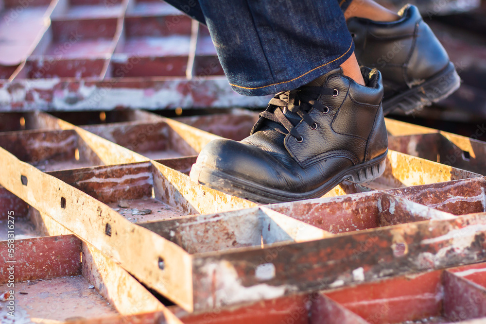 Foto de Wear safety shoes to ensure safety at work. construction ...