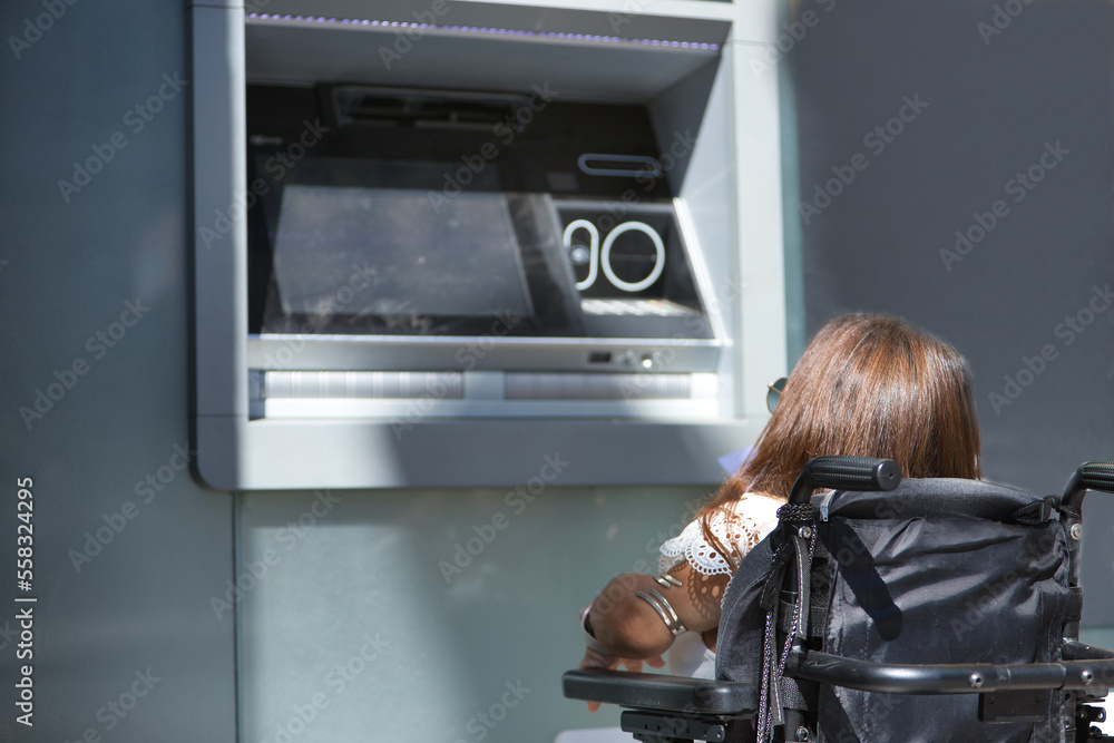 Disabled woman with reduced mobility and small stature in an electric ...