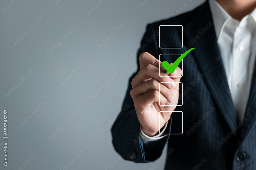 Checklist concept. Businessman checking mark on checkboxes, copy space ...