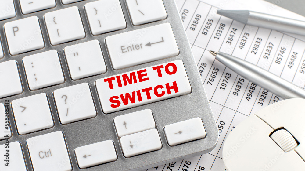 Foto de TIME TO SWITCH text on a keyboard wirh chart and pencil do ...