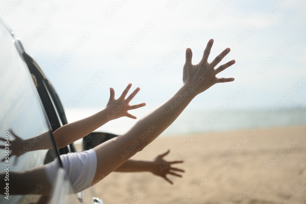 Hand out car window. Happy travel at beach. Family in car happy ...