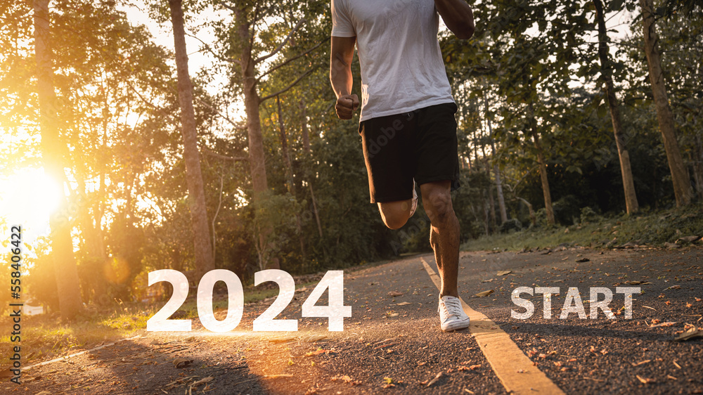 Young man asia running and sprinting on the road with new year 2024 ...