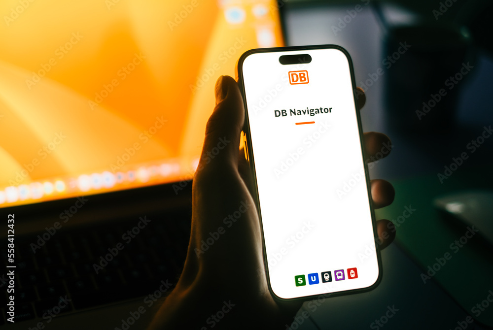 Foto de Deutsch bahn logo, man using DB app on smartphone. Düsseldorf ...