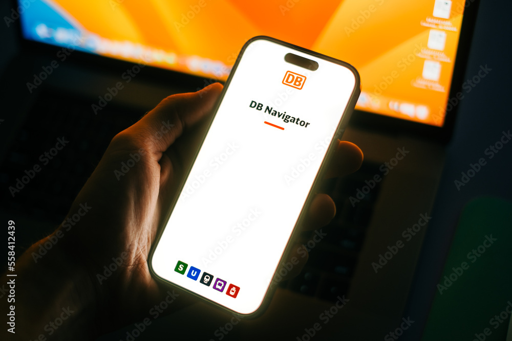Deutsch bahn logo, man using DB app on smartphone. Düsseldorf, Germany ...