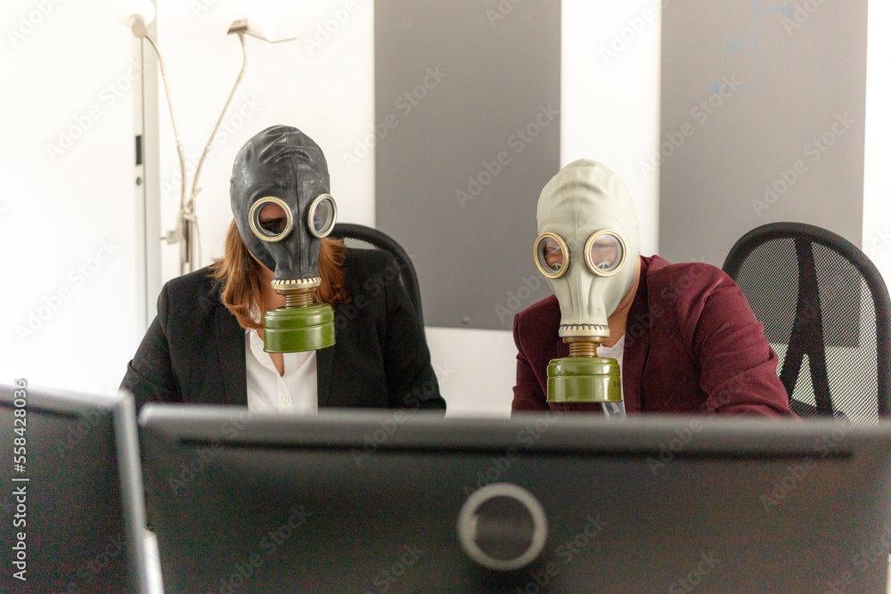 Man and woman working on a computer in the office, businesspeople in a ...