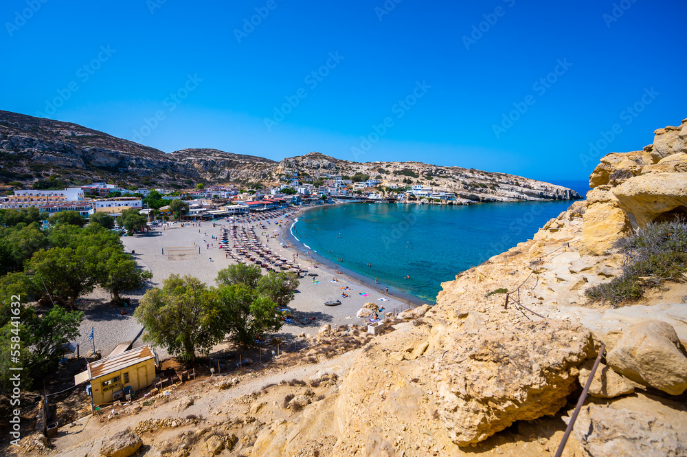 Famous Matala beach with caves, known for hippies in the 70's. Stock ...