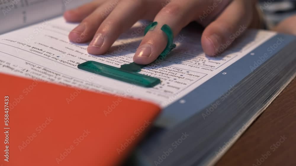 Reading tools for dyslexia. Child reading book using finger focus ...