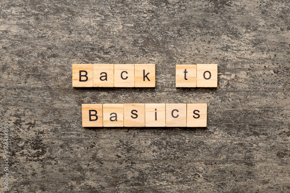 back to basics word written on wood block. back to basics text on table ...