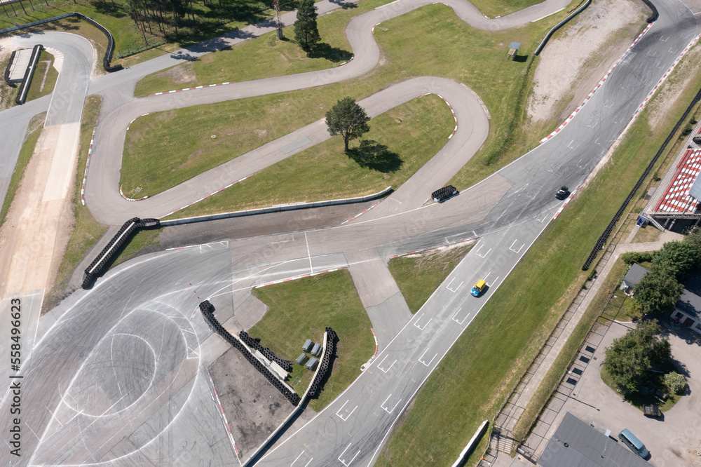 an aerial view of a race track with cars driving on the track and a ...