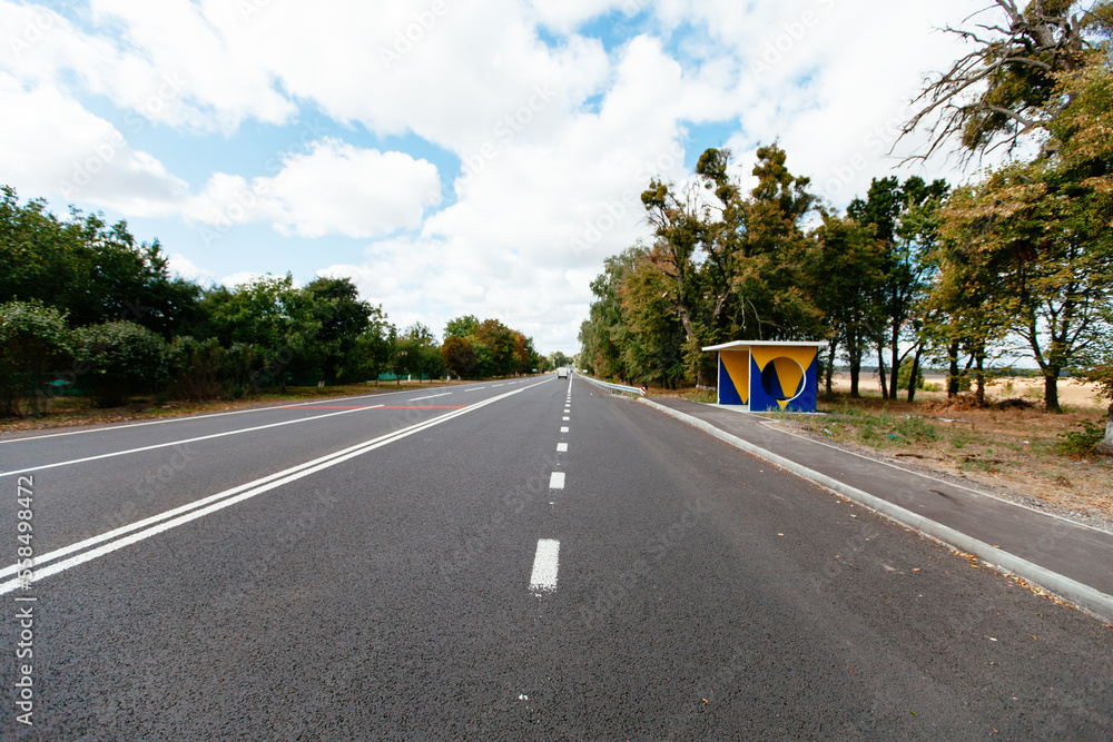 New asphalt road with markings and road signs in the sun's rays Stock ...