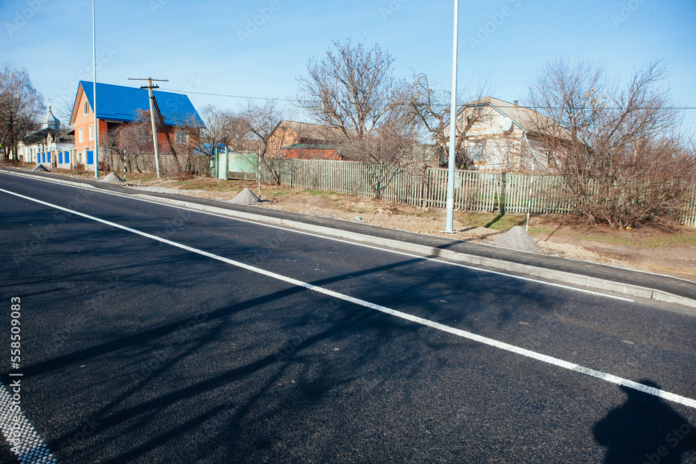 New asphalt road with markings and road signs in the sun's rays Stock ...